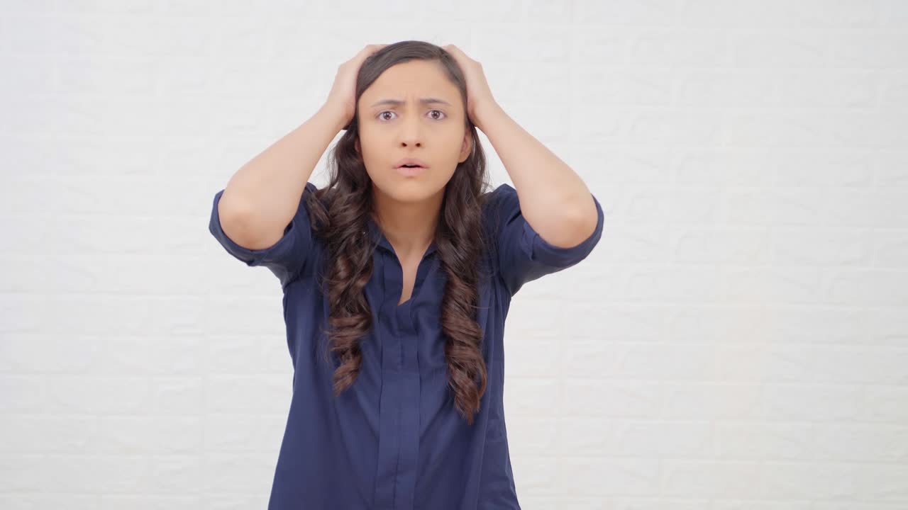 Premium stock video - Shocked and scared indian girl
