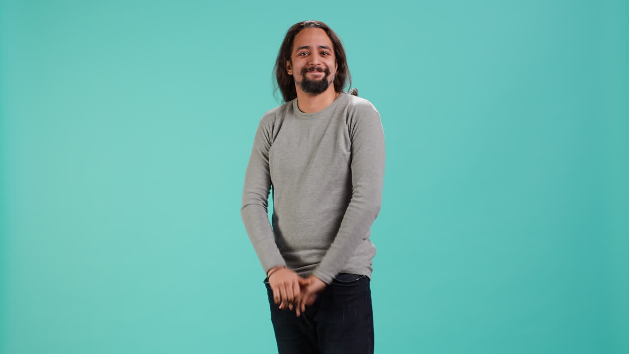 Portrait of shy man fidgeting with fingers in his hair Premium Stock ...