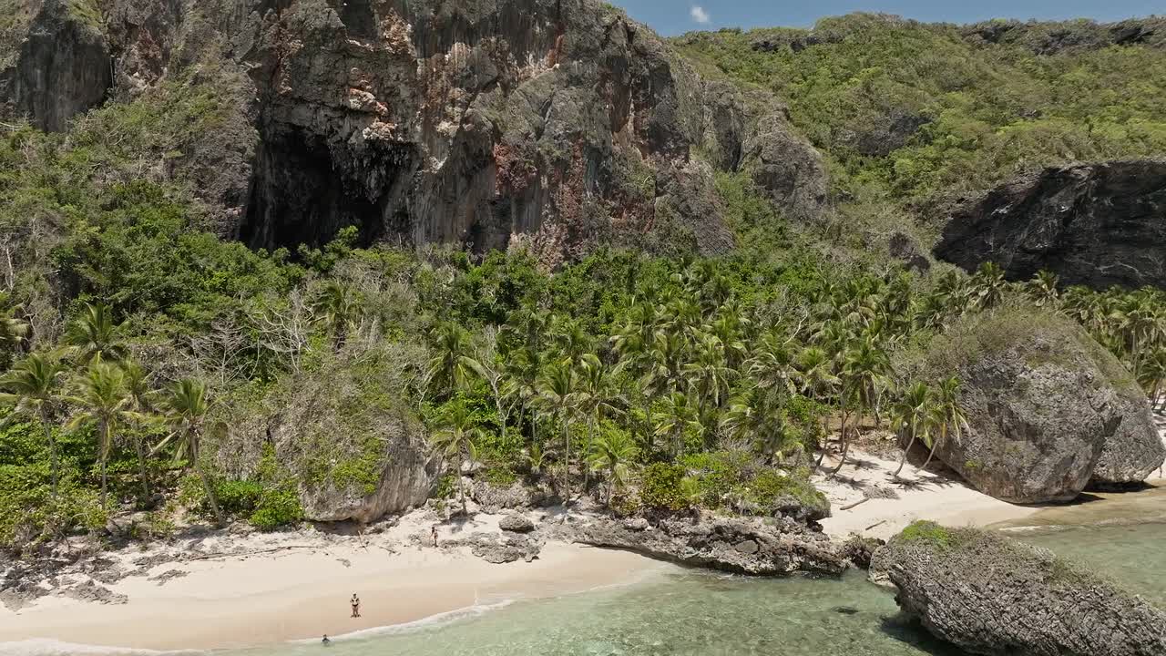 Aerial Flyback From Playa Fronton Beach With People In Summer Season ...