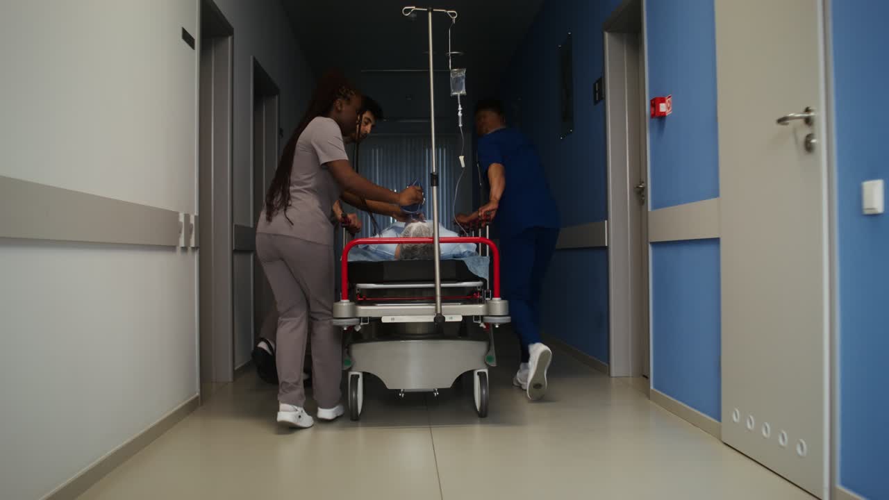 Hospital Staff Moving Patient on Stretcher | Premium Stock Video Footage