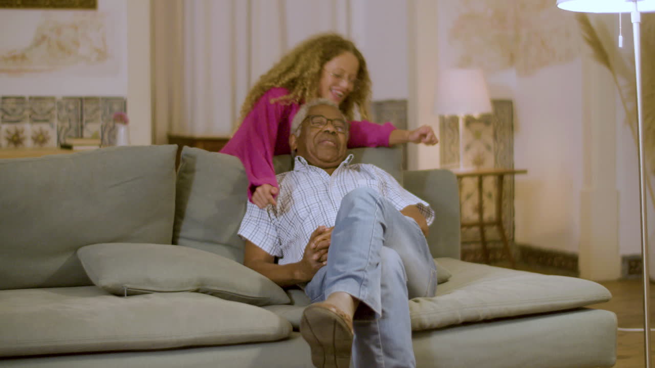 Free stock video - Young cute girl in pyjamas kissing her grandpa goodnight