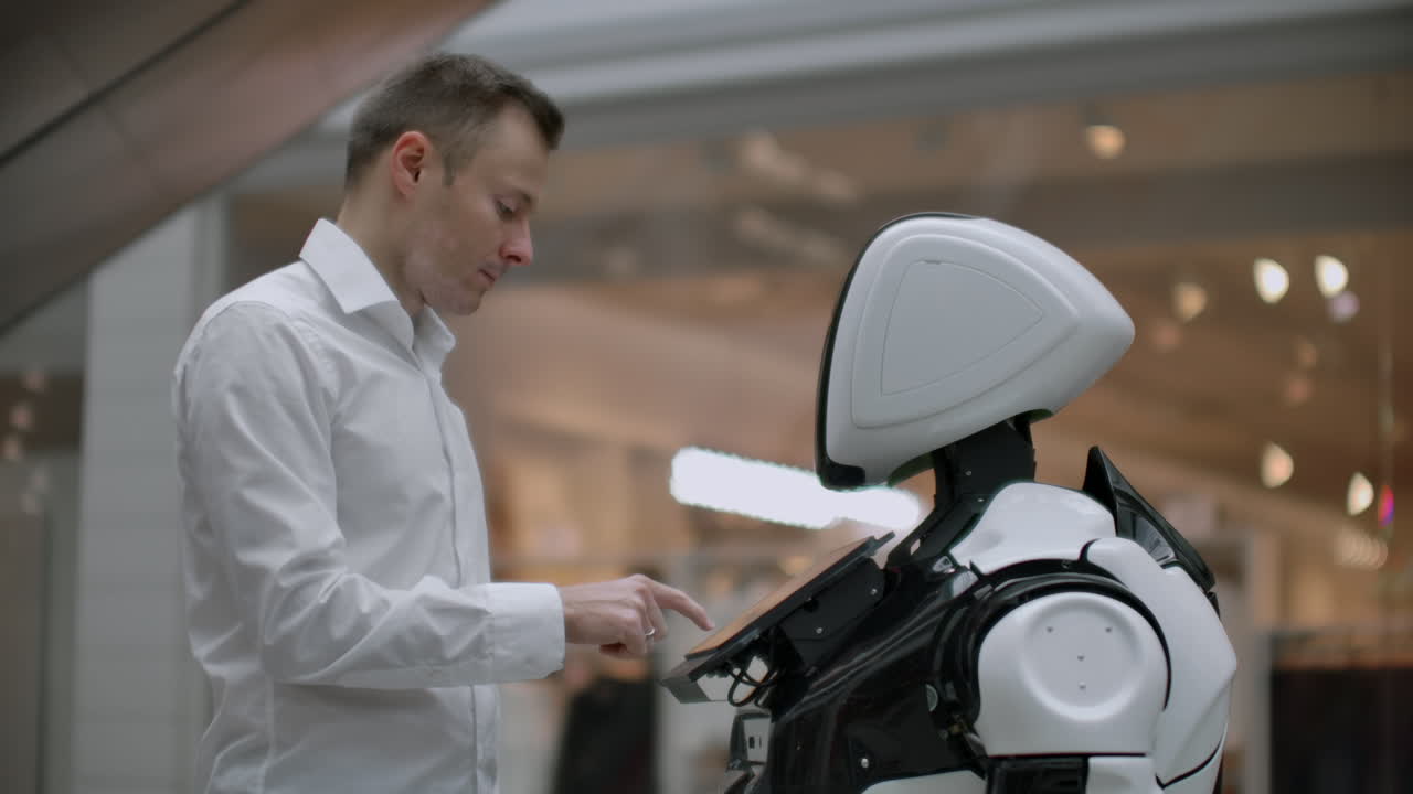 Electronics Engineer Working Scientist Inventor On Robot Construction. Slow-motion. Modern ...