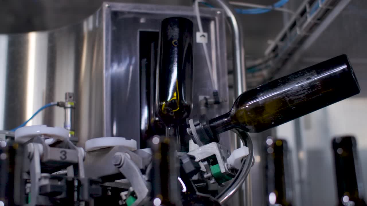 Premium stock video - Automated wine bottling process and equipment in ...