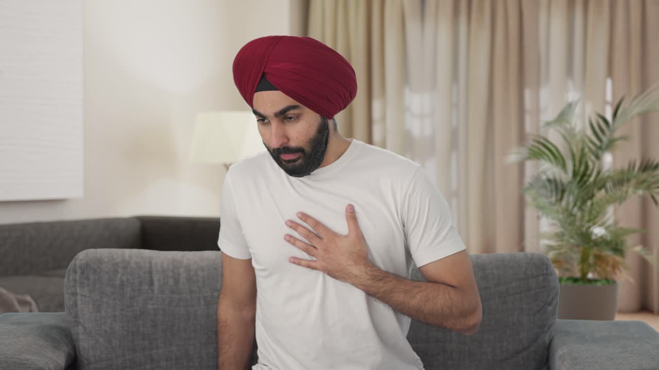 Premium stock video - Sick sikh indian man having a heart attack