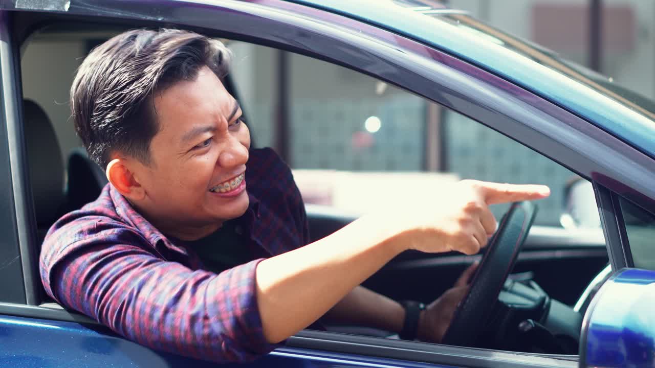 Frustrated Driver Leans Out Of His Vehicle, Gesturing Aggressively And ...