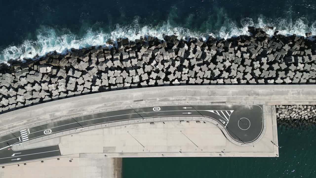 Premium stock video - Ocean waves crash on large breakwater jetty ...