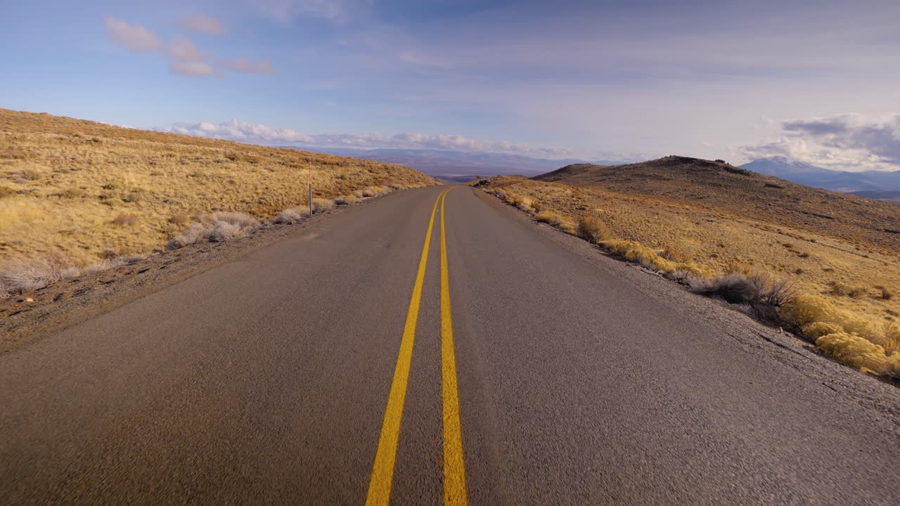 Mountain walk smooth walking first person perspective on desolate road ...