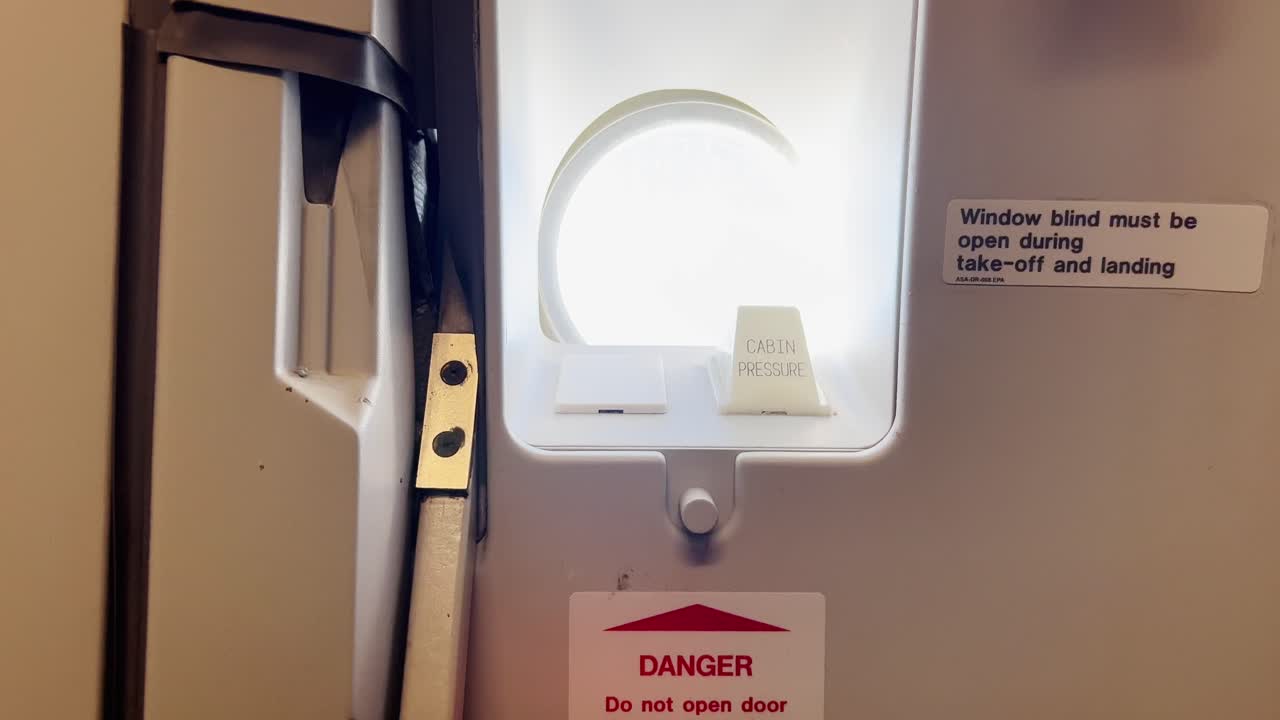 Airbus aircraft handle door and warning signs Premium Stock Video Footage