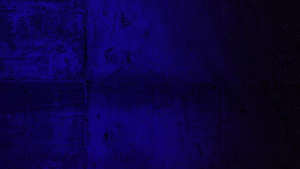 Red and blue police lights flash on textured wall at night, creating ...