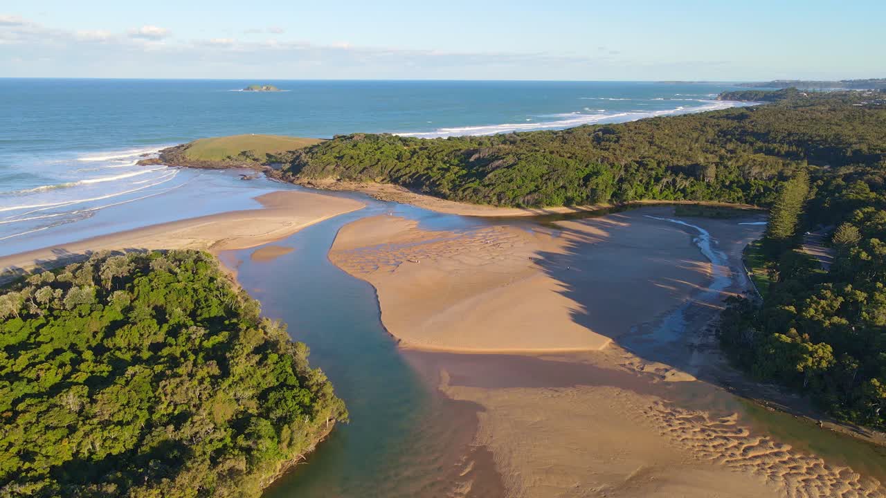 Premium stock video - Moonee creek with brown sand and shallow water ...