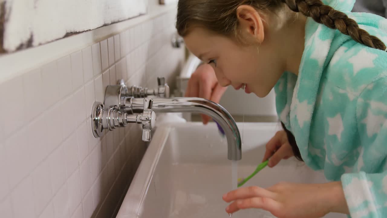 Premium stock video - Father and daughter brushing off their teeth 4k