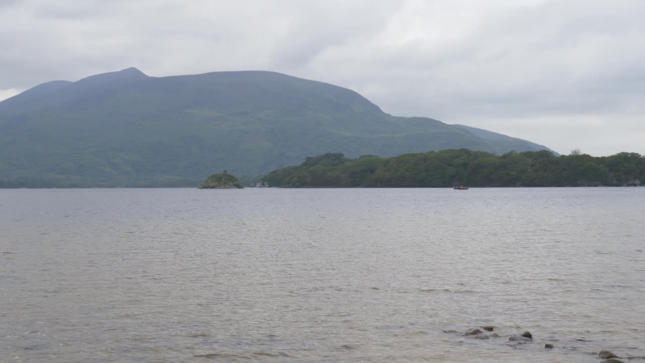 Deep Lake Of Muckross Alongside Rugged Coves With Mountain View In ...
