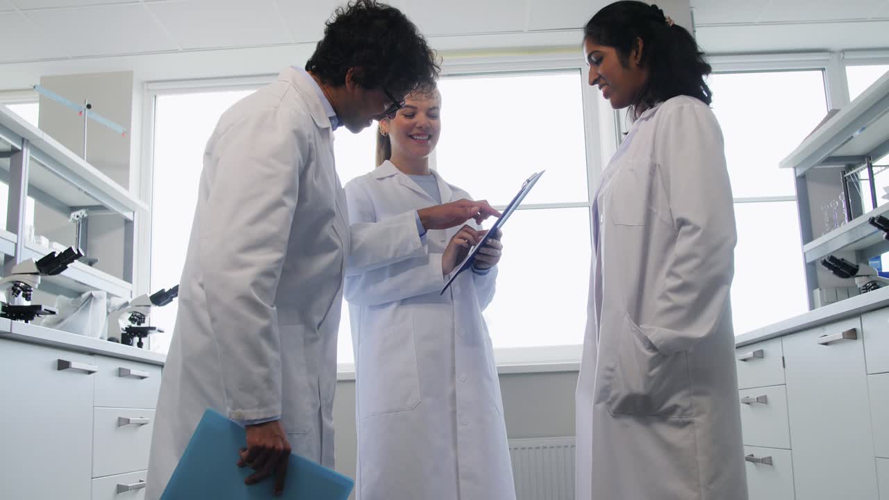 Premium stock video - International group of scientists in laboratory ...