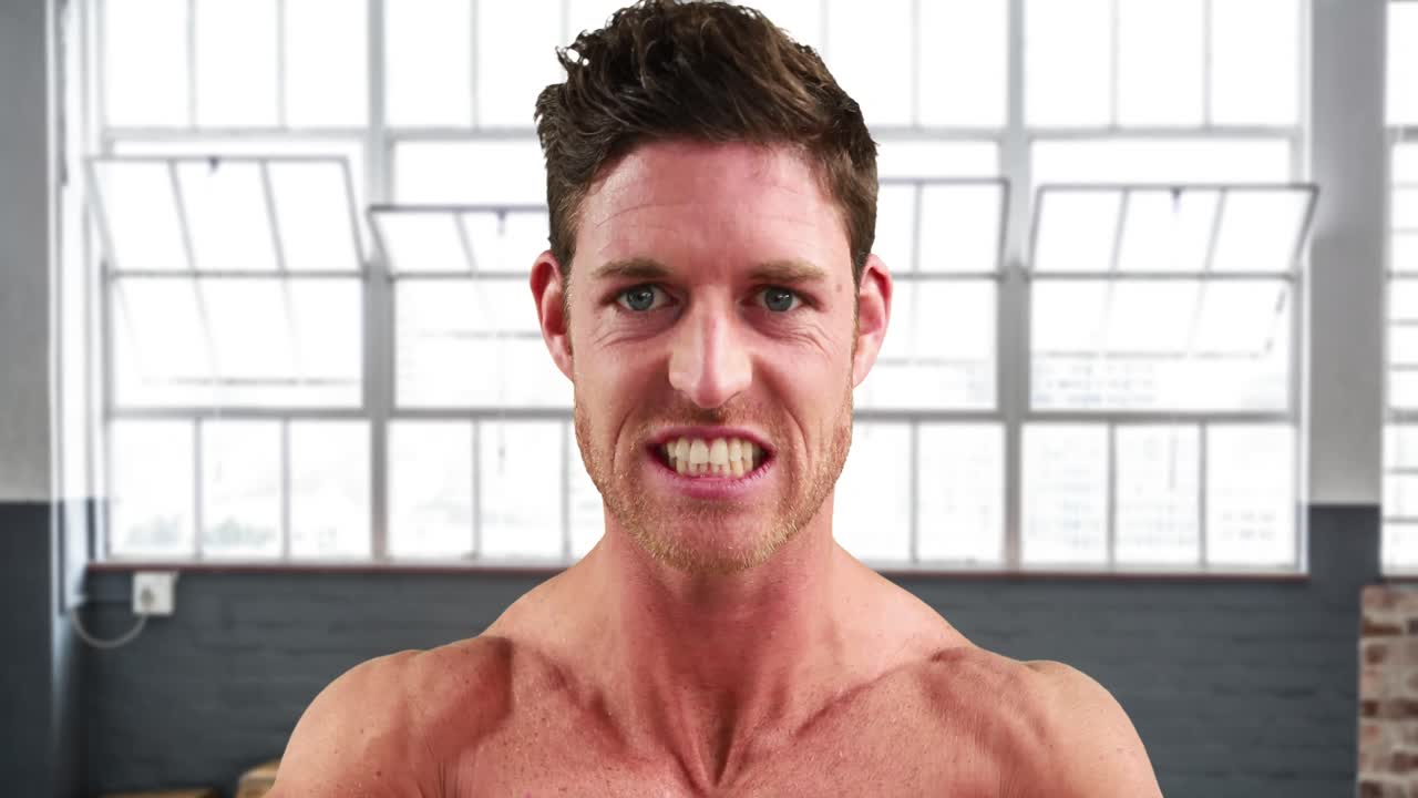 Premium stock video - Man flexing his muscles 4k