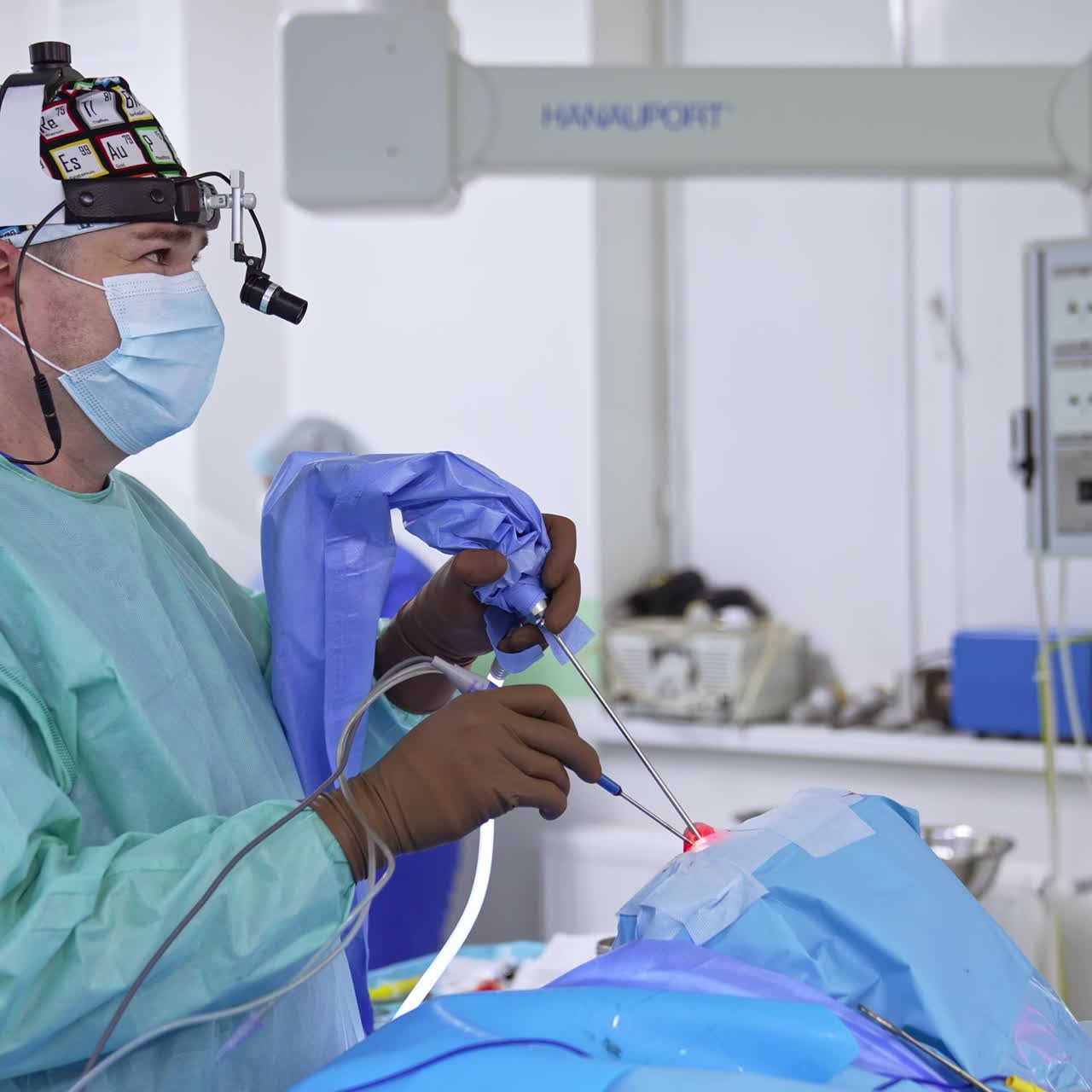 Male surgeon inputs long instruments into nose of a patient. Doctor ...