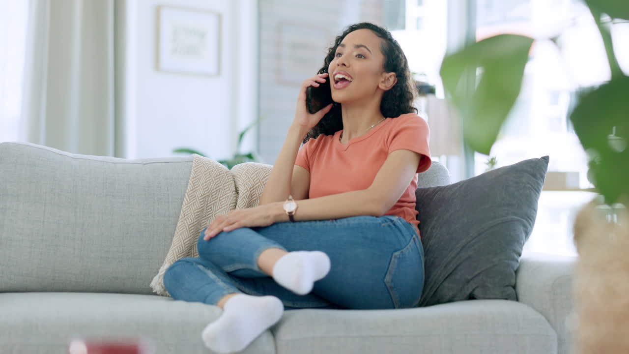 Phone call, gossip and a black woman on a sofa Premium Stock Video Footage