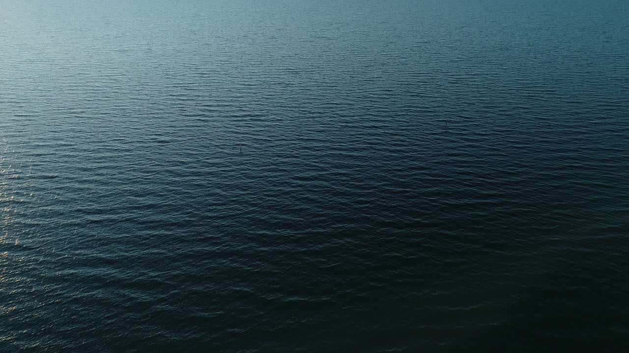 Smooth Aerial Perspective Of Ocean Ripples While Bird From Left To ...
