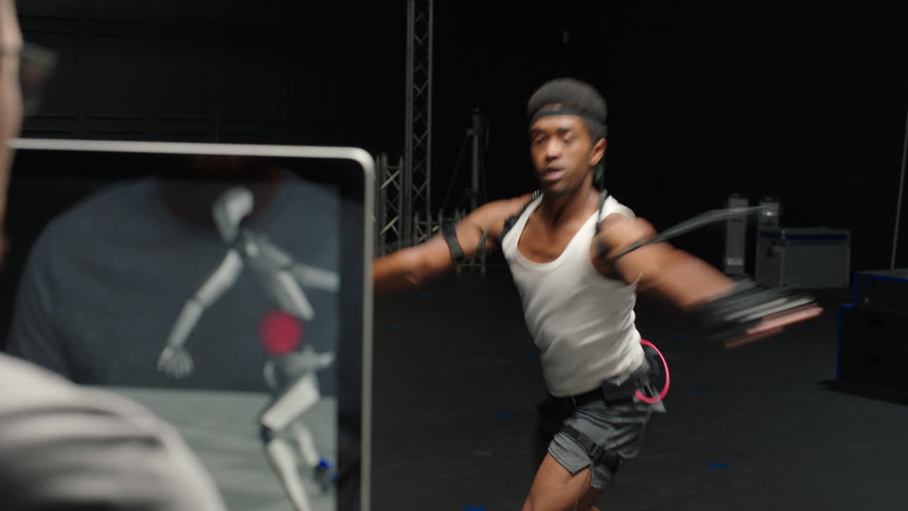 Dancing man wearing motion capture suit in studio actor wearing mo-cap ...