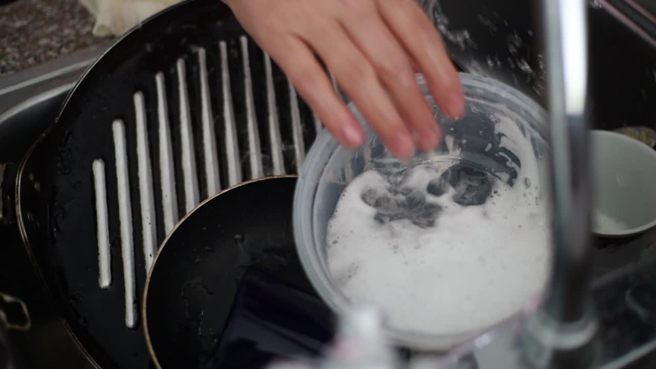 Wash Rinse Plastic Container In Kitchen Sink Under Running Water CLOSE ...