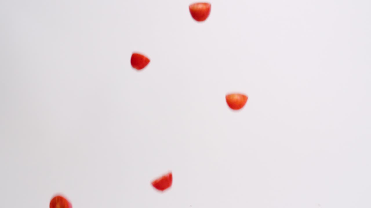 Premium stock video - Fresh, bright red halved cherry tomato fruits and ...