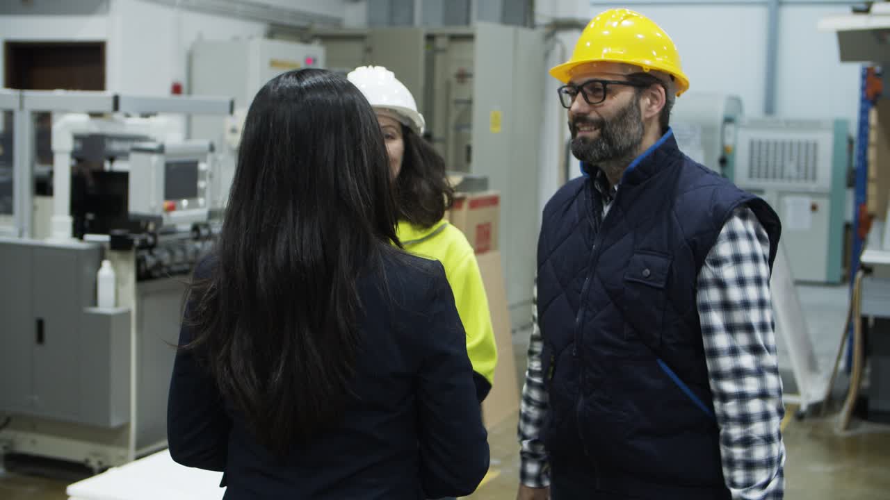 Premium stock video - Back view of project manager shaking hands with ...