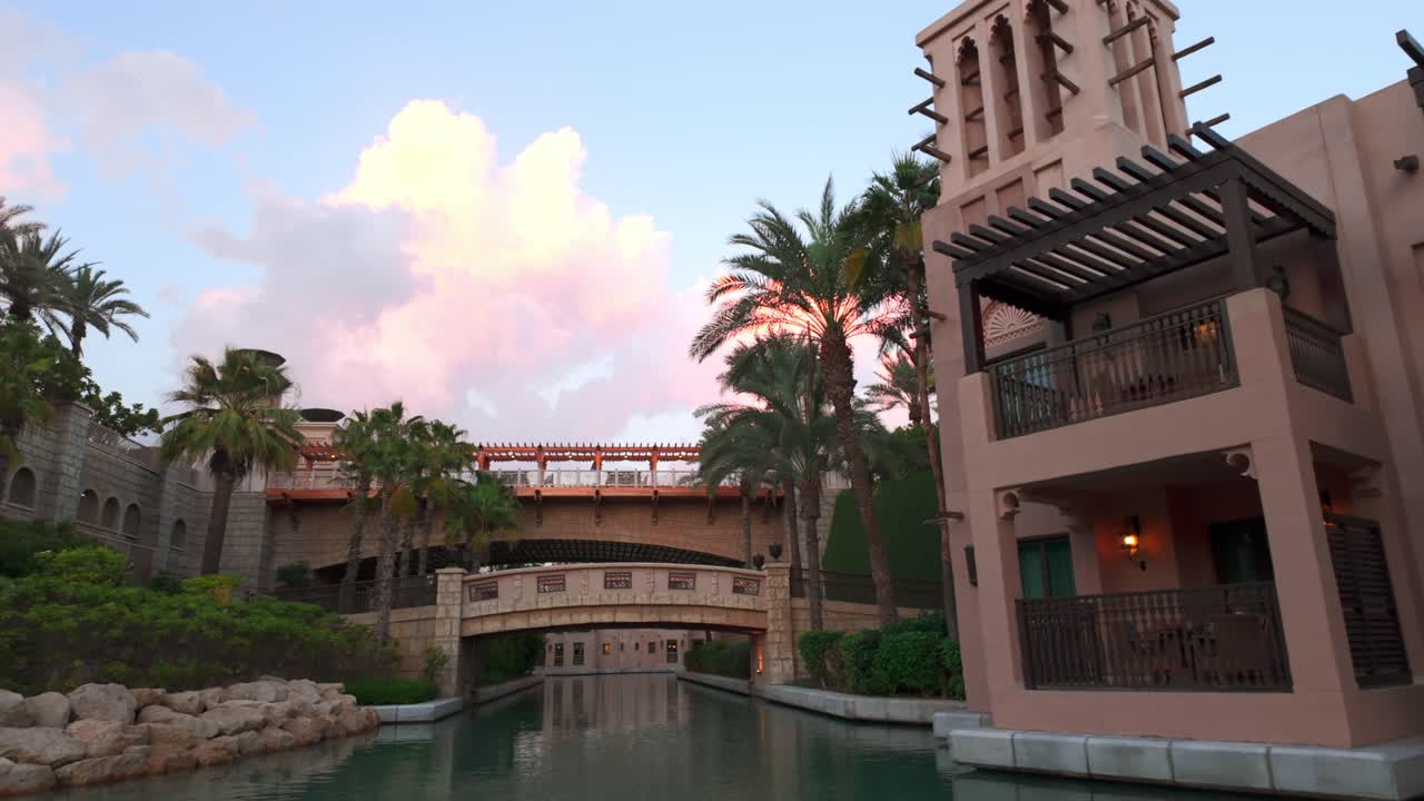 Scenic canal view with traditional arabian architecture Premium Stock ...