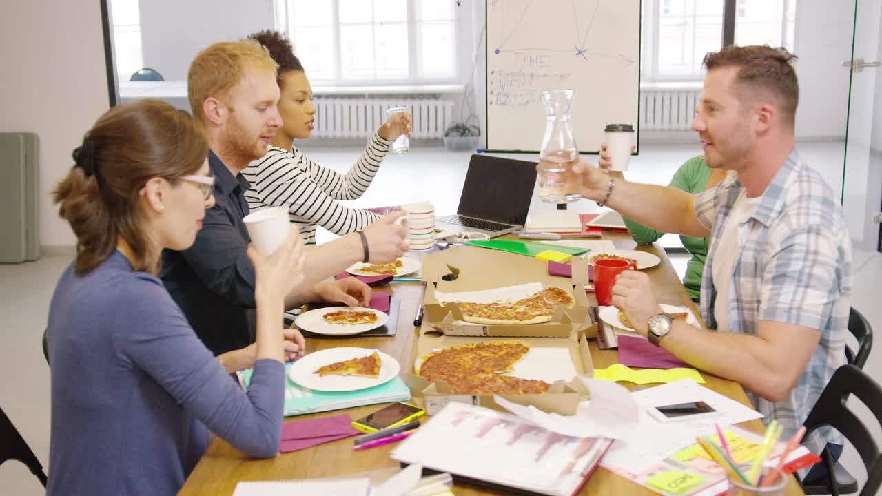 People eating in office Premium Stock Video Footage