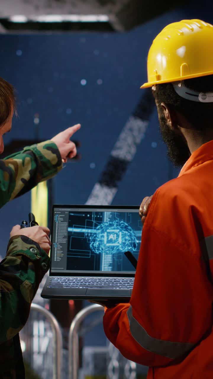 Vertical Video Military soldier and engineer on offshore oil rig uses ...