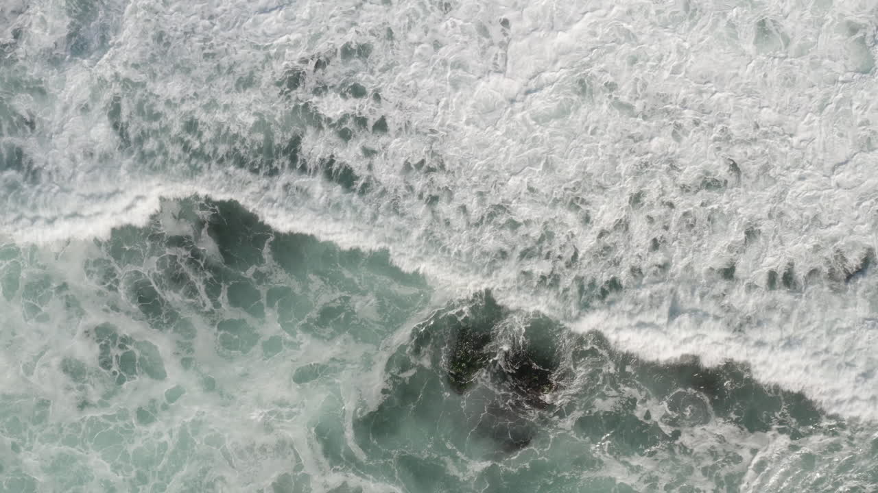 4K Overhead Of Different Ocean Surface Textures As Waves Break Over ...