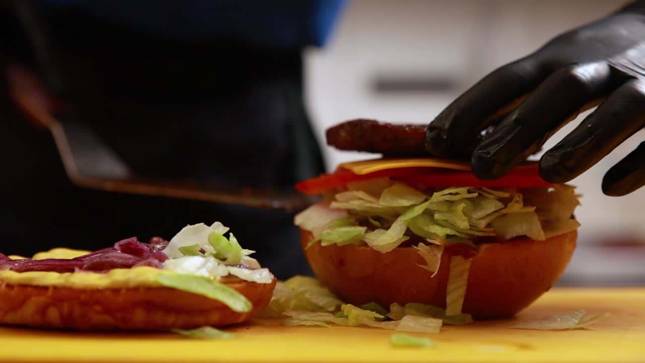 Chef preparing a delicious burger | Premium Stock Video Footage