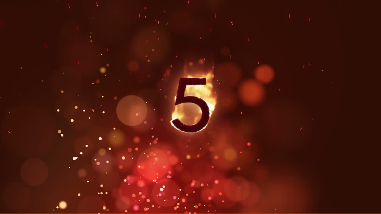 5 in flames on orange background Premium Stock Video Footage