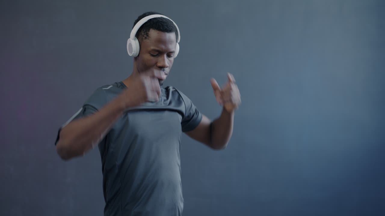 Man listening to music while working out | Premium Stock Video Footage