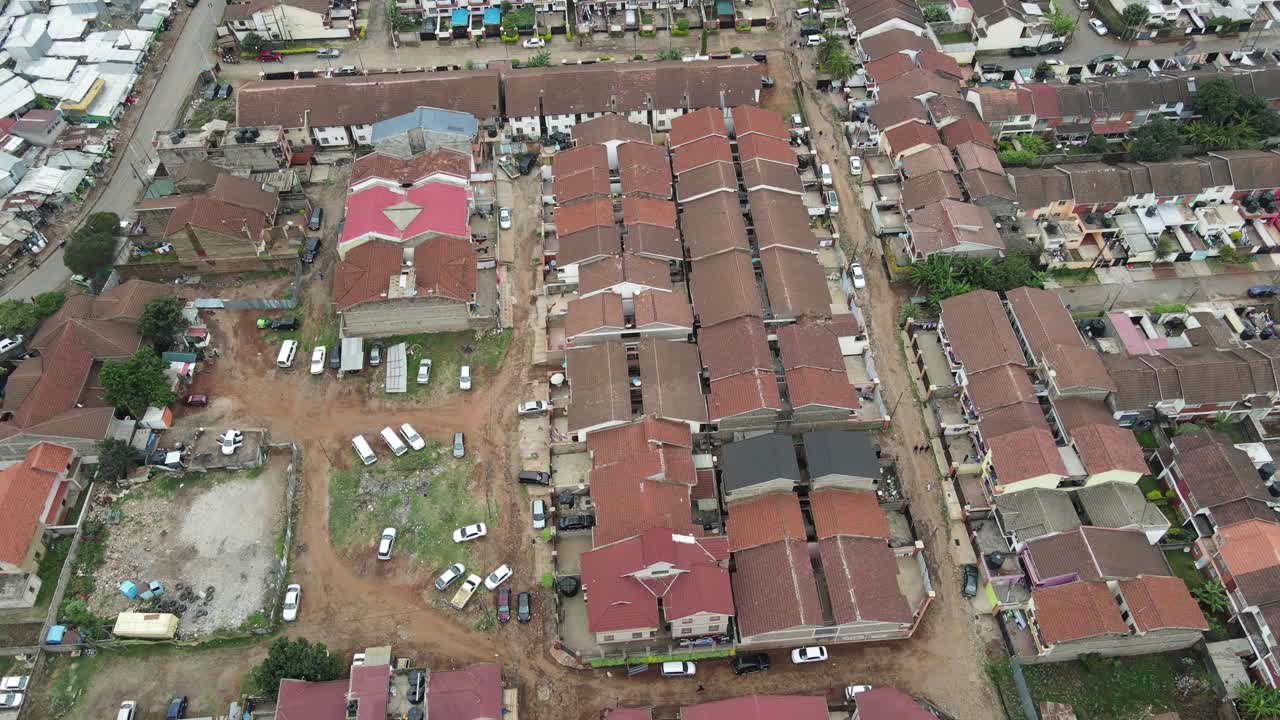 Premium stock video - Aerial view, modern buildings by poor housing ...