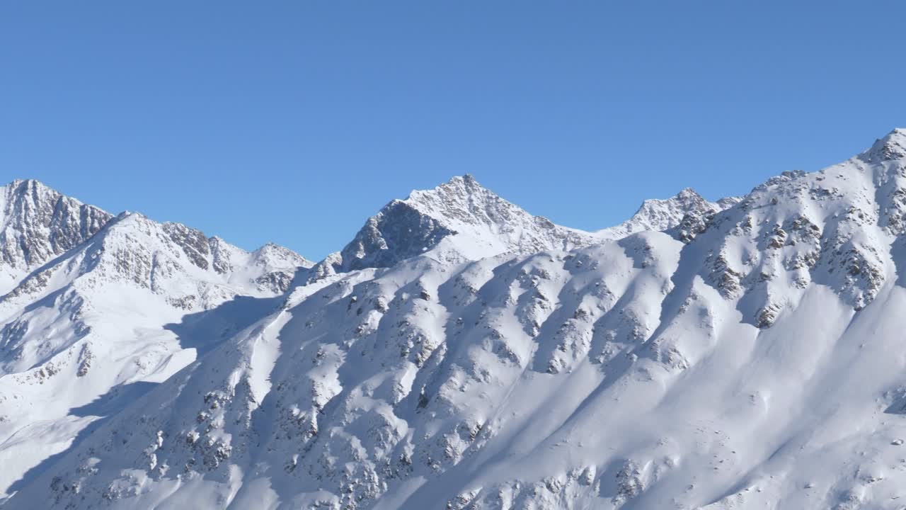 Premium stock video - Details on rocky and snowy alpine ridges in the ...