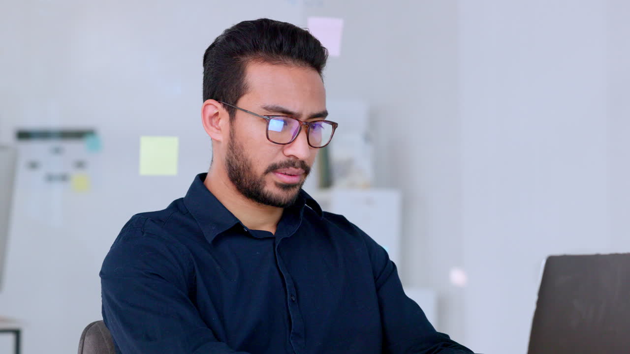 A stressed and overworked male administrator | Premium Stock Video Footage