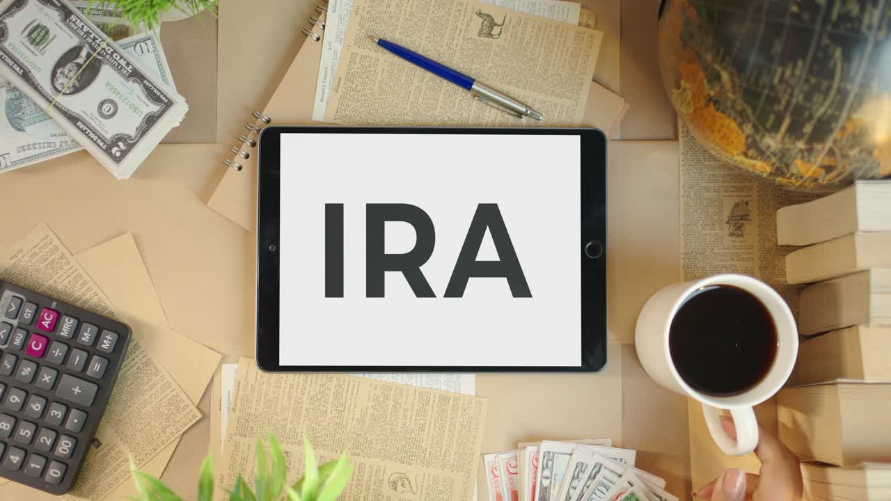 Ira displaying on finance tablet screen Premium Stock Video Footage