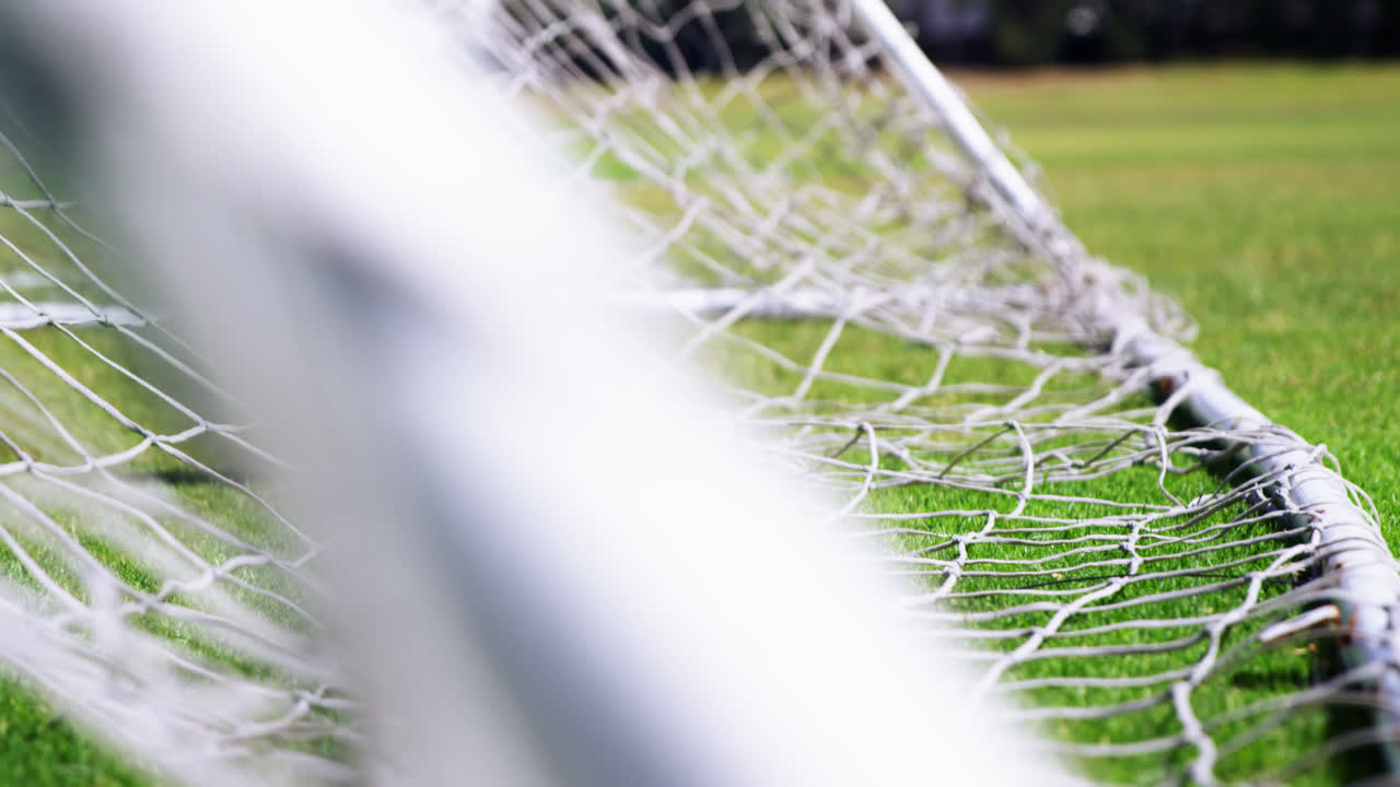 Premium stock video - Net goal post in the field
