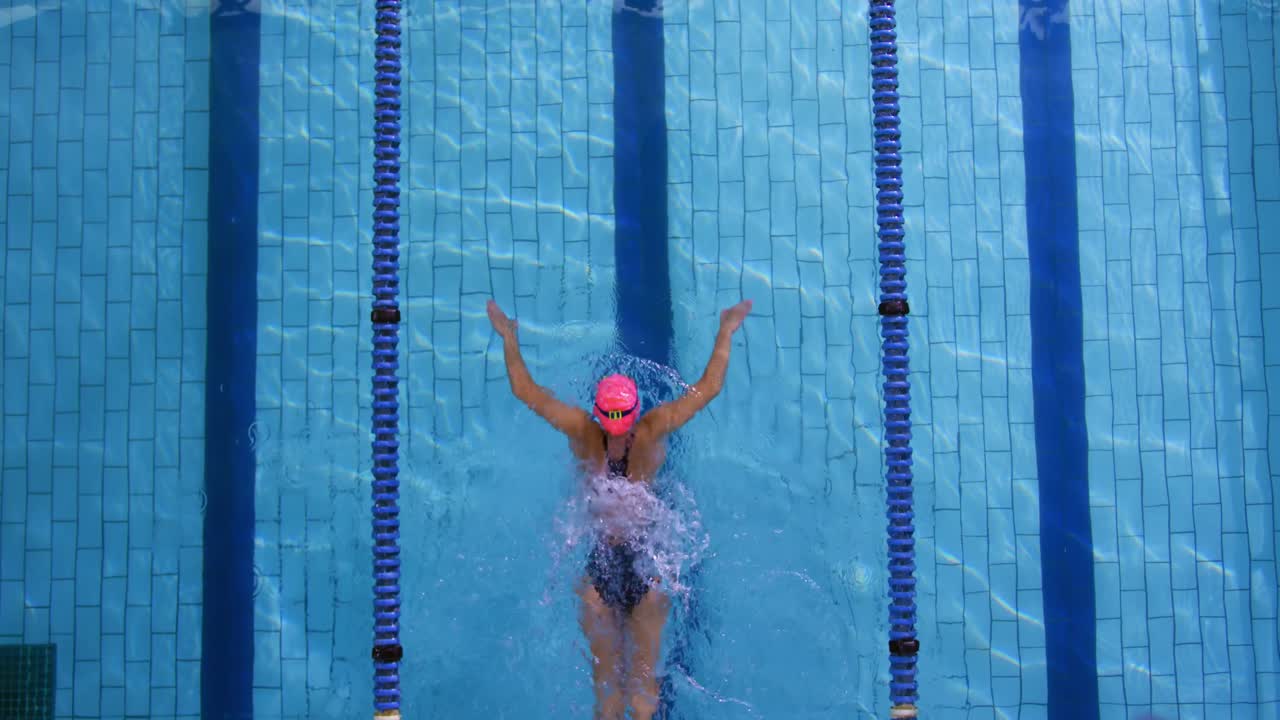 Premium stock video - Swimmer training in a swimming pool