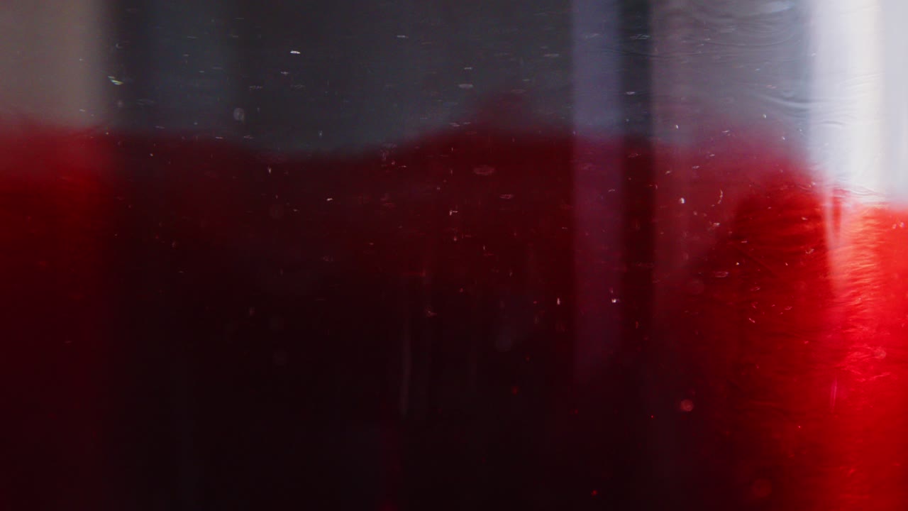Premium stock video - Red blood floating in clear water