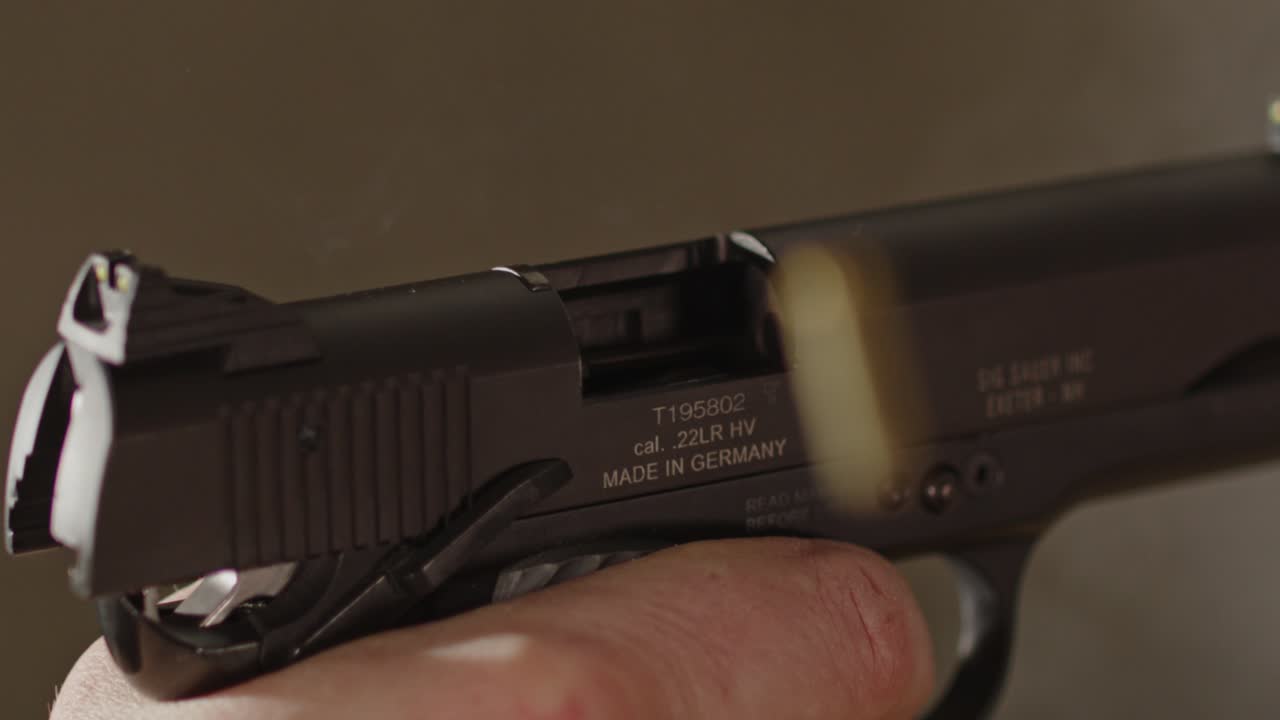 Pistol Being Fired In Slow Motion And Shell Casing Flying Out Free ...