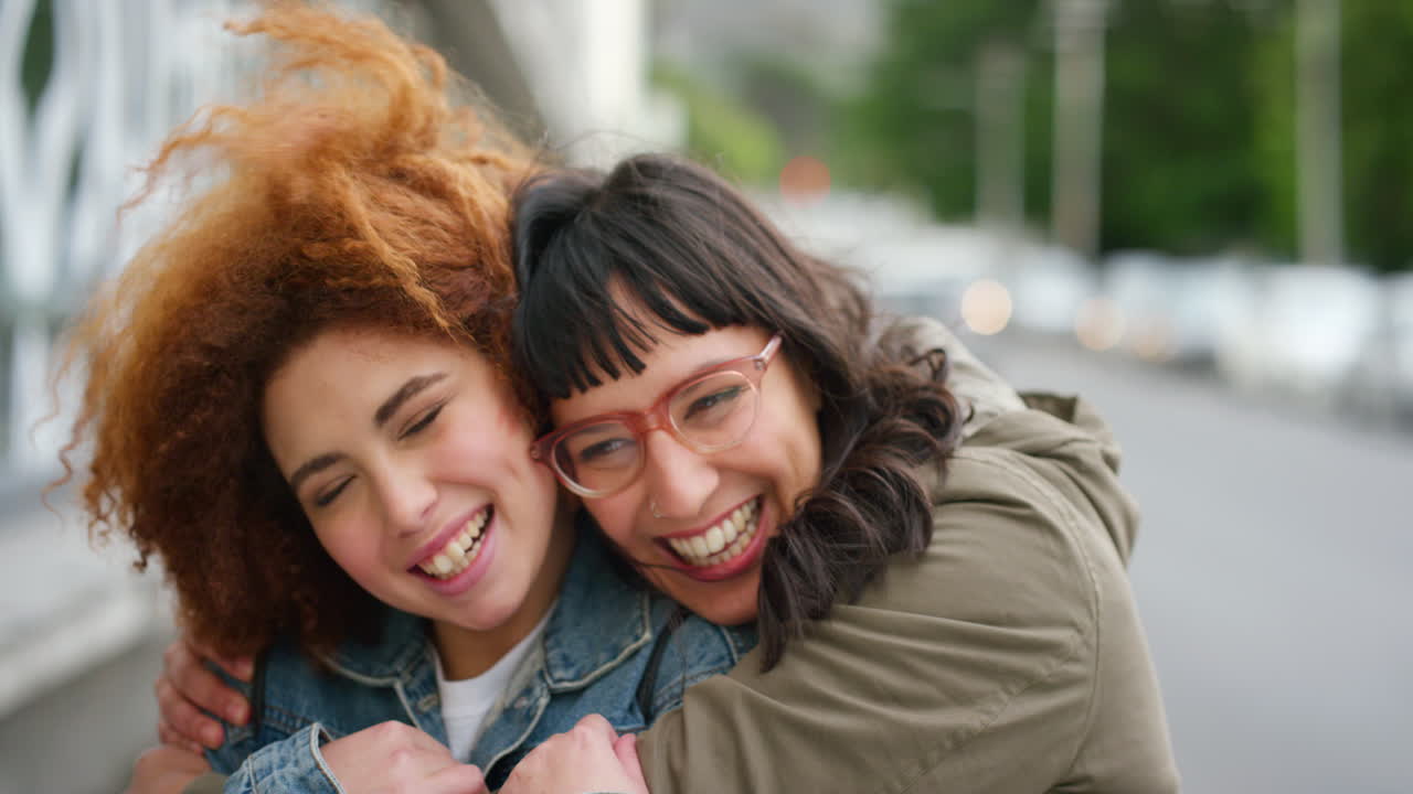 Premium stock video - Portrait of happy friends hugging