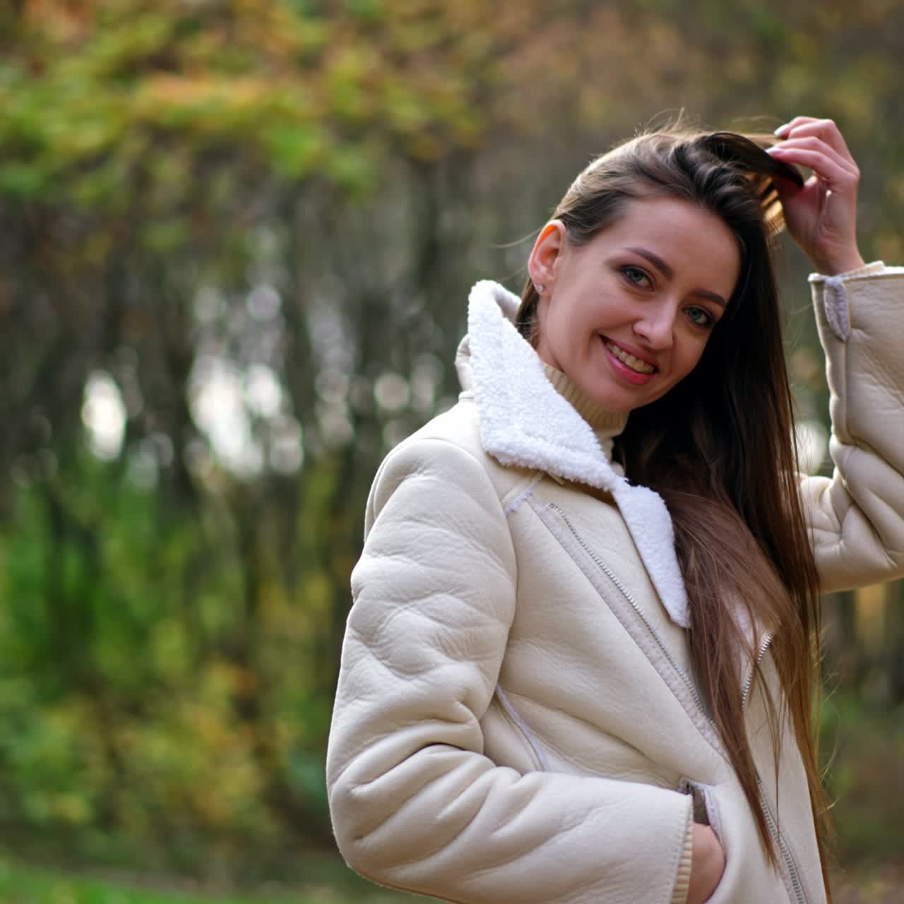 Happy resilient brunette lady smiling into camera. Woman in white ...