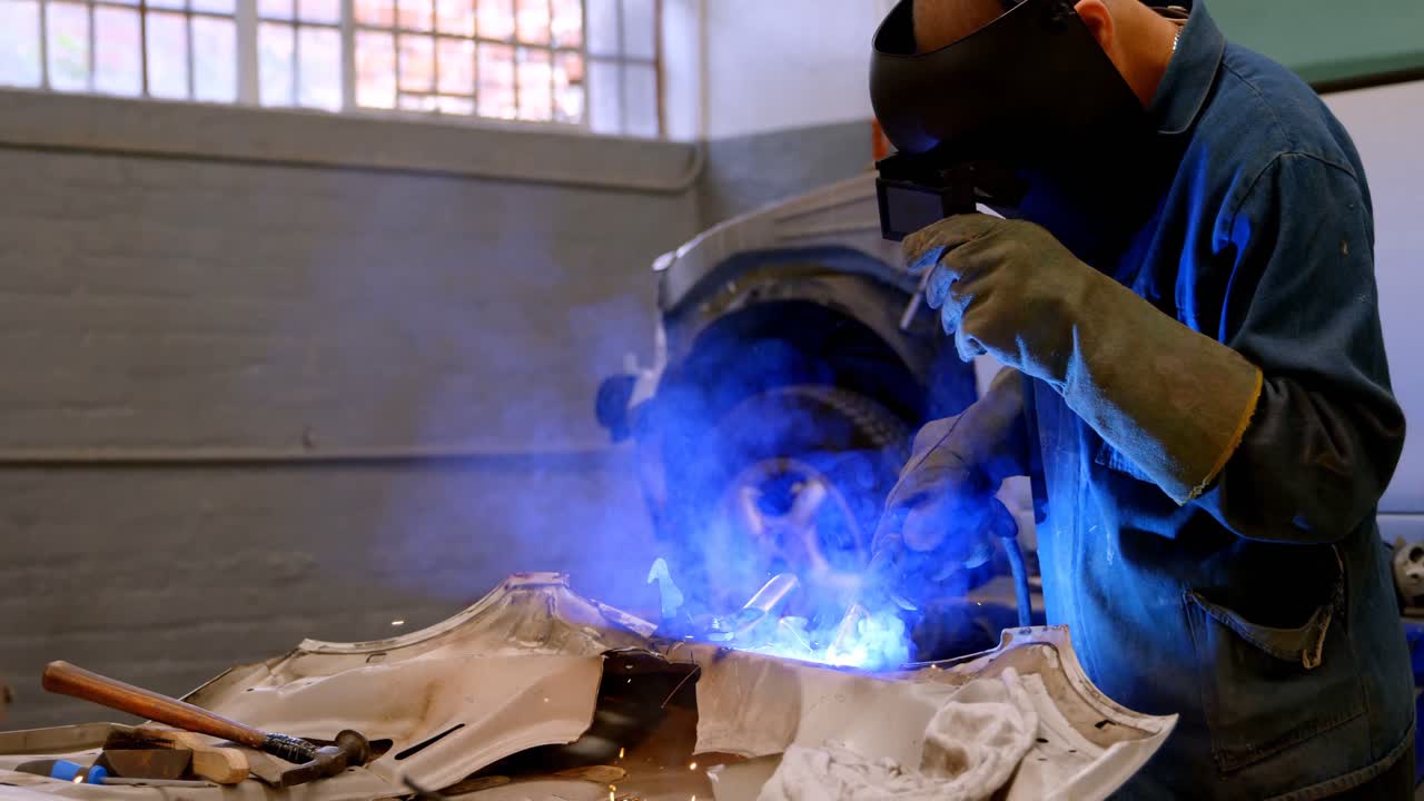 Mechanic Using Wielding Torch On A Car Part 4k Free Stock Video Footage ...