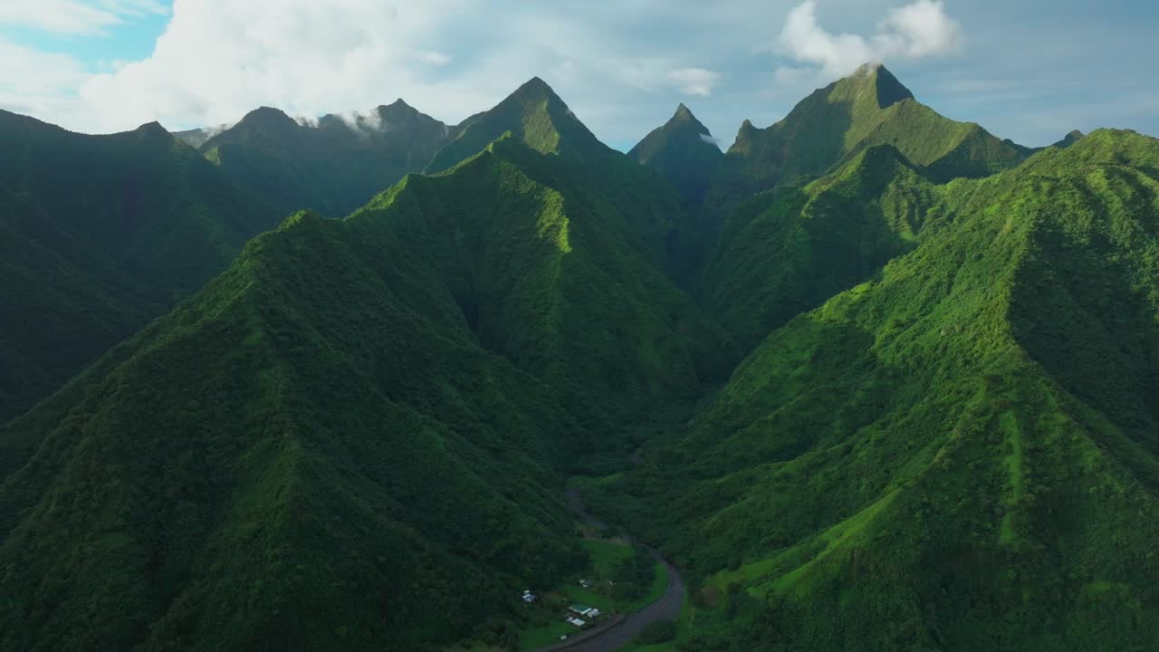 Late afternoon sunset green island mountain peaks Teahupoo Tahiti ...
