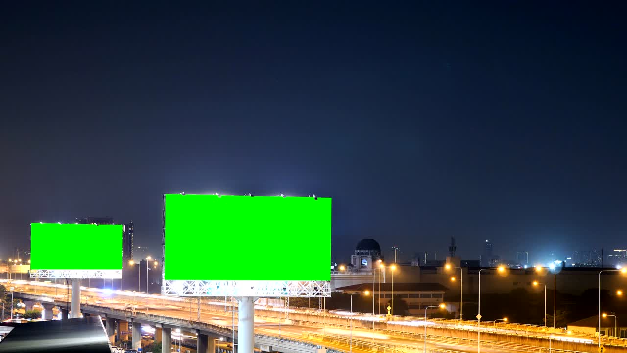 Green screen of advertising billboard on expressway during the twilight ...