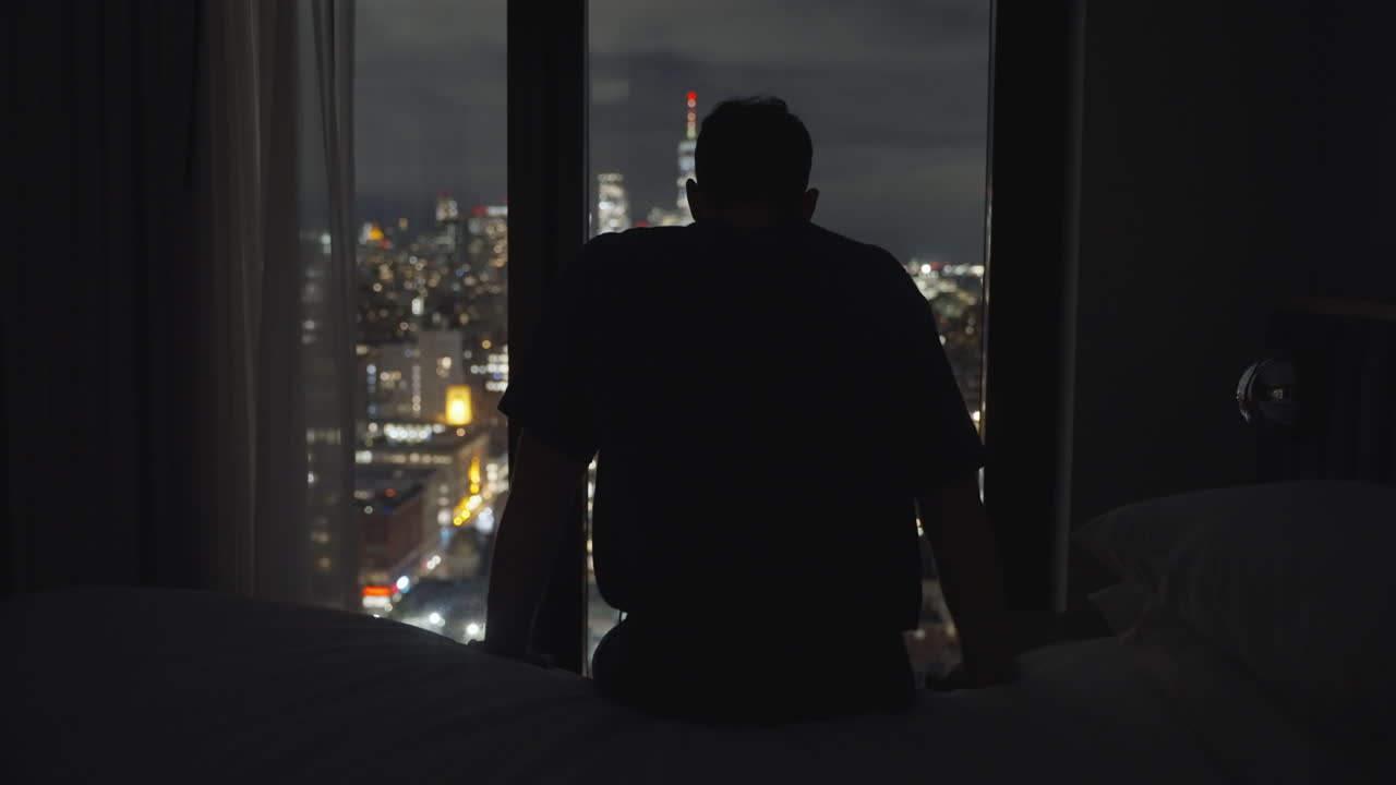 Man turning off the light in bed room | Premium Stock Video Footage