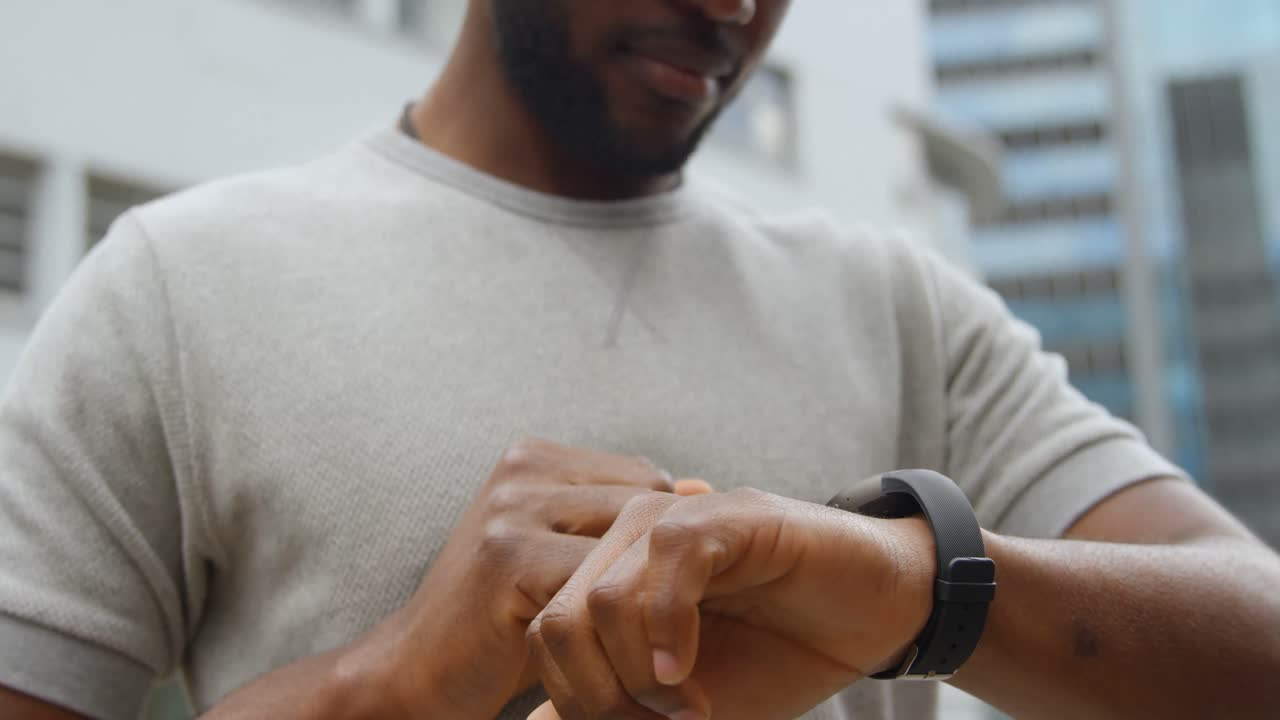 Man using smartwatch in city 4k | Premium Stock Video Footage