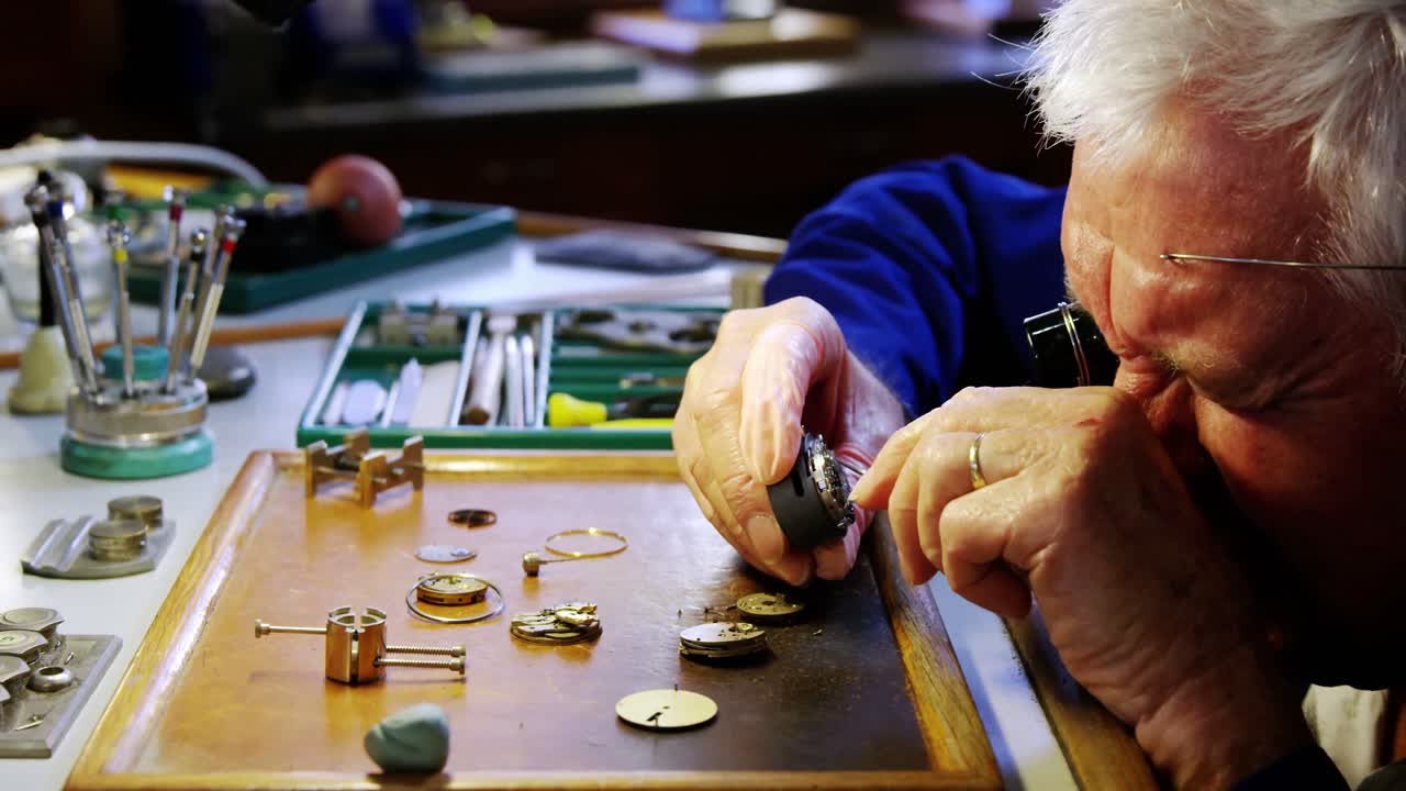 Horologist repairing a watch | Premium Stock Video Footage