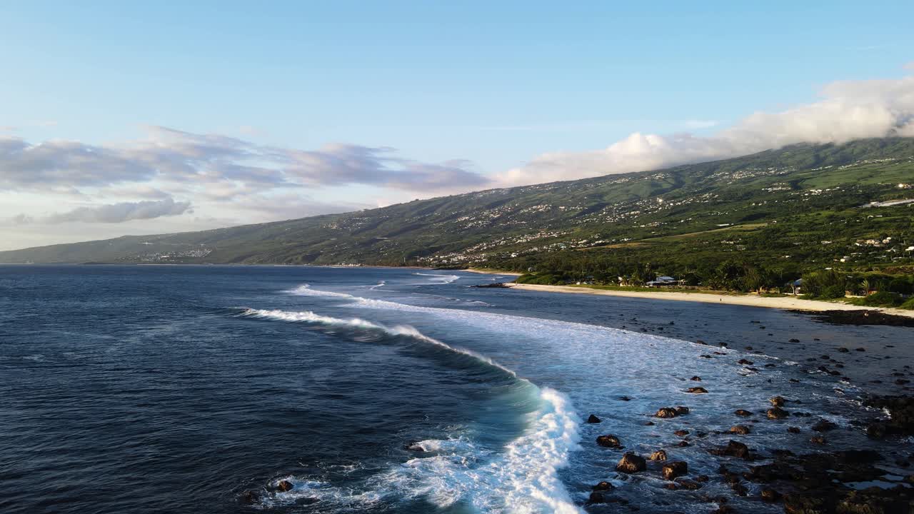 Drone footage of waves at the beach at the reunion island during sunset ...