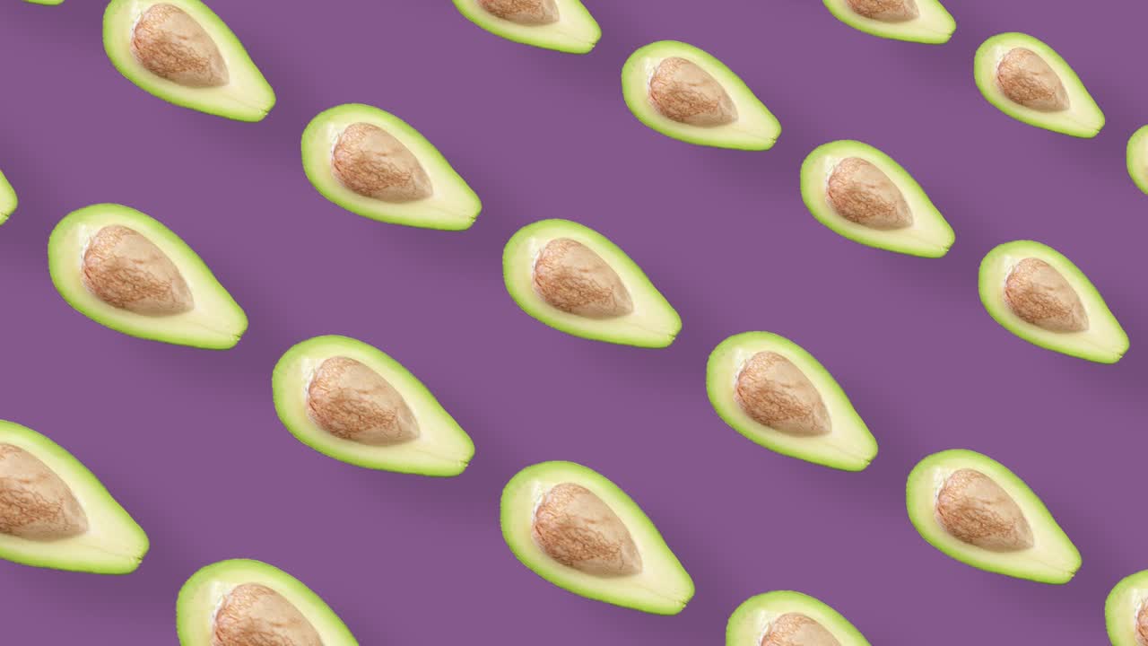 Colorful fruit pattern of fresh avocados on purple background. Seamless ...